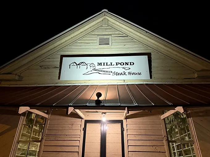Welcome to Mill Pond Steakhouse, where the unassuming exterior hides a carnivore's paradise. It's like finding a diamond mine disguised as a cozy country cottage!