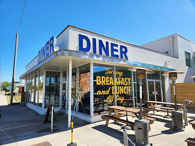 A diner so inviting, it's like a warm hug for your stomach! This retro-chic facade promises all-day breakfast bliss and lunch that'll make you forget about dinner.