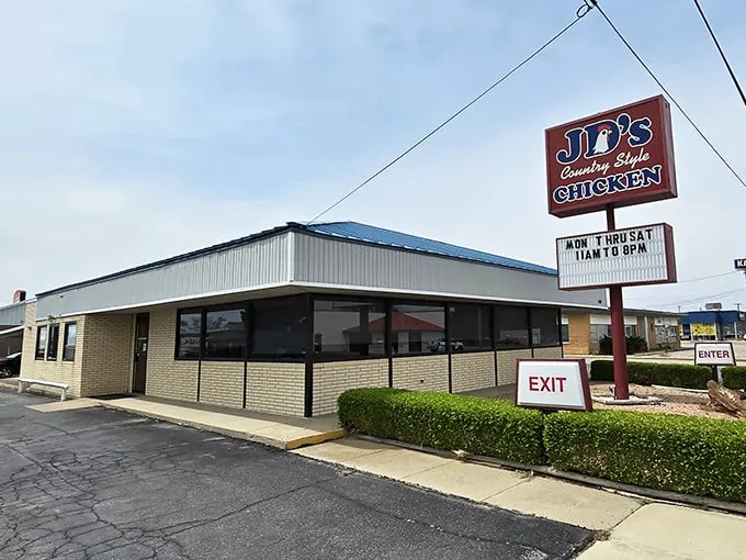 The iconic red JD's sign beckons hungry travelers like a lighthouse for the famished. Simple exterior, extraordinary food—the best kind of Midwest promise.