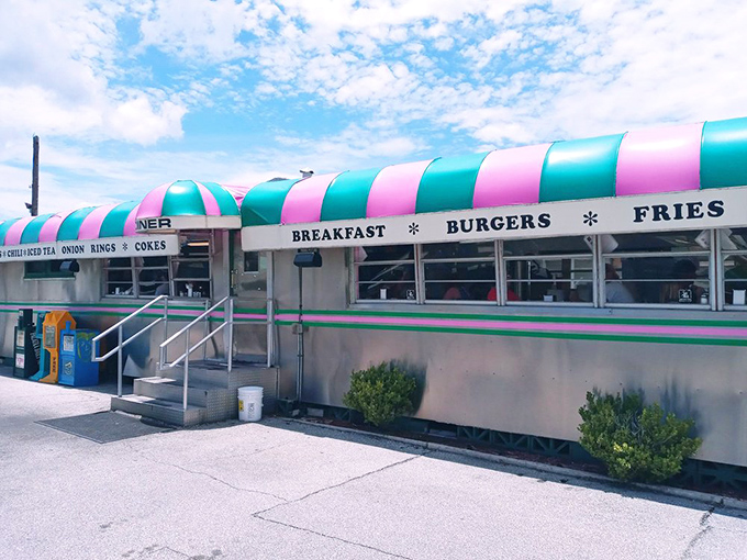 Step into a time machine disguised as a diner! Angel's Dining Car's exterior is a retro rainbow of promise, beckoning burger lovers with its iconic striped awning.