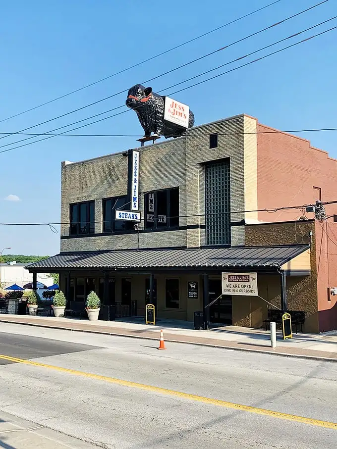 The unassuming brick exterior of Jess & Jim's Steakhouse stands as Kansas City's culinary secret hiding in plain sight, complete with vintage signage that's weathered decades.