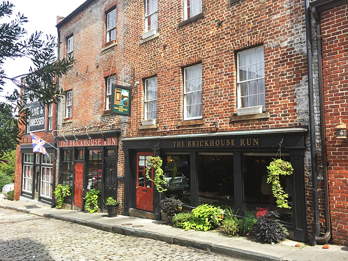 Historic charm meets culinary magic where those bright red doors practically shout, "Come in, the cobblestones have been waiting for you!"