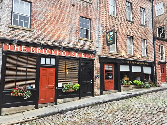 Historic charm meets culinary magic where those bright red doors practically shout, "Come in, the cobblestones have been waiting for you!"