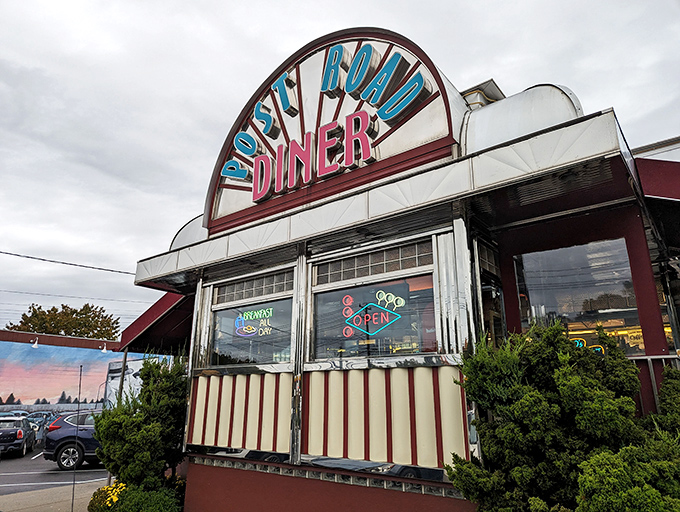Retro chic meets modern appetite! The Post Road Diner's neon sign beckons like a lighthouse for the hungry, promising a voyage through time and taste.