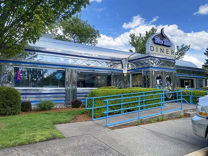 Step into a time machine disguised as a diner! The Blue Moon's gleaming exterior promises a journey back to the golden age of American cuisine.