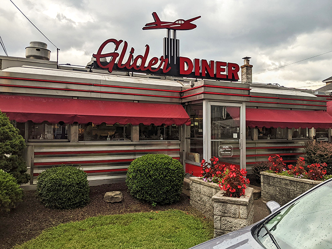 Welcome to the Glider Diner, where nostalgia meets neon! This retro gem's exterior is like a time machine with a side of fries.