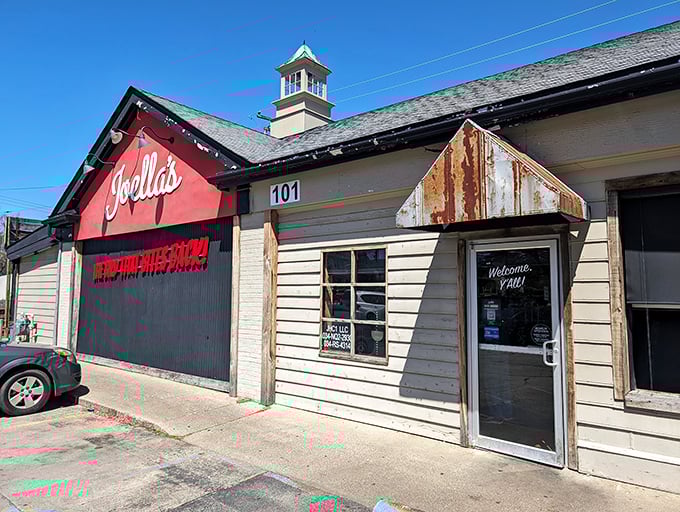 Welcome to flavor town! Joella's exterior promises a spicy adventure with its bold red facade and cheeky slogan.