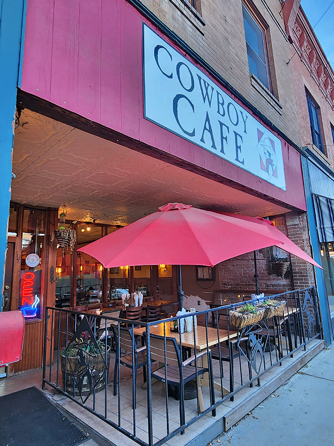 Howdy, partner! The Cowboy Cafe's vibrant red awning is like a beacon for hungry travelers, promising Western hospitality and hearty grub.