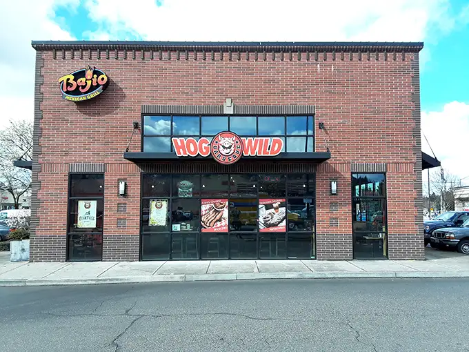 Welcome to BBQ paradise! Hog Wild's brick exterior might be unassuming, but inside lies a smoky wonderland that'll make your taste buds dance.