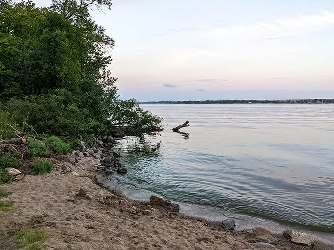 Big Stone Lake's serene beauty beckons. A wooden dock invites adventure, promising fishing tales and sunset views at Minnesota's hidden gem.