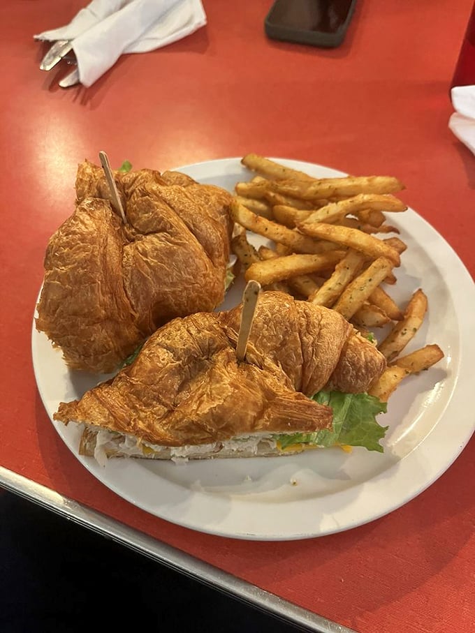 Croissant sandwich alert! Flaky, buttery, and stuffed with goodness, this beauty is what happens when French sophistication meets American diner charm. Ooh la la!