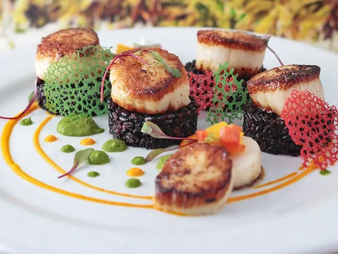 Seared scallops on a bed of black rice – it's like formal wear for your taste buds. Tuxedo optional, appetite required!