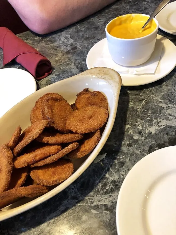 Spud-tacular! These crispy potatoes with gooey cheese sauce are what comfort food dreams are made of.