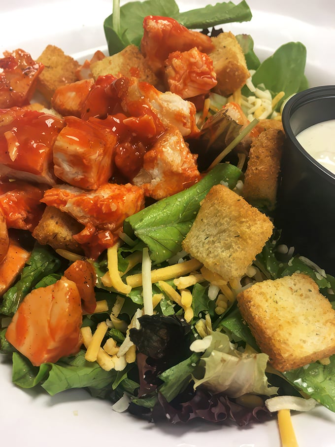 A buffalo chicken salad that lets you pretend you're eating healthy while still enjoying that wing sauce you really came for.