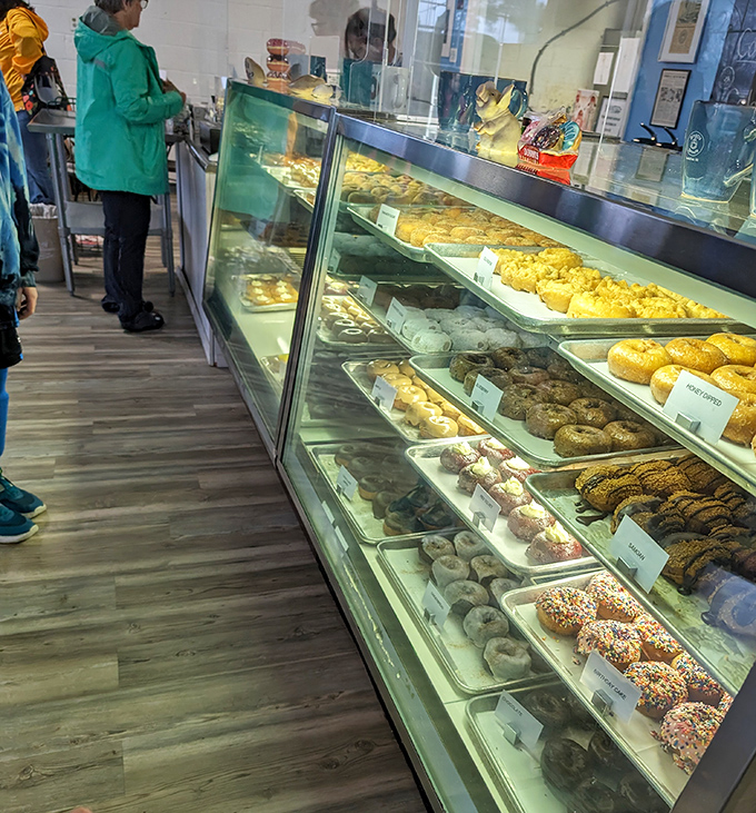The early bird gets the donut! These savvy customers know that patience is a virtue, but fresh donuts are worth the wait.