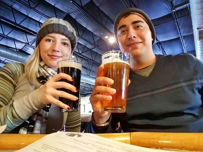 Cheers to good company and great beer! These happy campers know the secret to life: friends, brews, and barbecue.