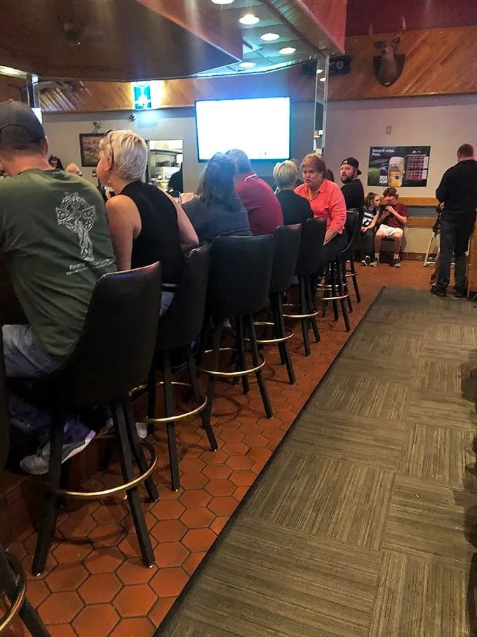 The happiest place on earth? It might just be this bar, where pizza dreams come true and friendships are forged over shared appetizers.