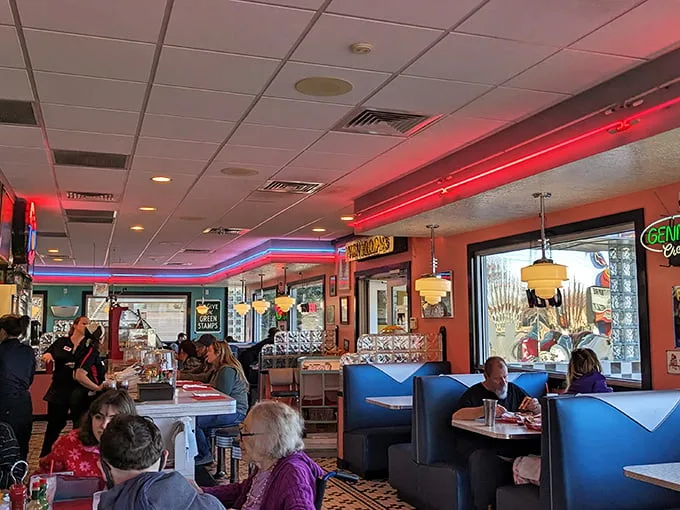 Where locals and travelers converge over plates of bacon and coffee refills. The morning light through those windows makes everyone look like they're in a Hopper painting.