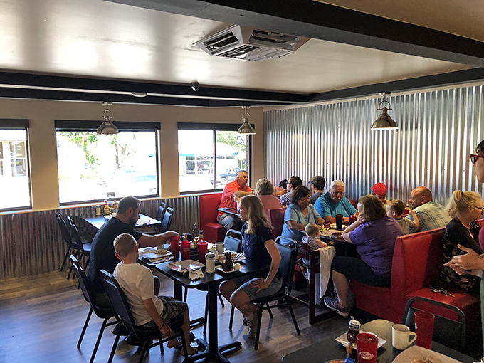 The breakfast club in session – families, couples, and solo diners united by the universal language of good food. Notice nobody's looking at their phones.
