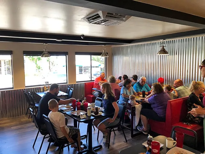 The breakfast club in session – families, couples, and solo diners united by the universal language of good food. Notice nobody's looking at their phones.