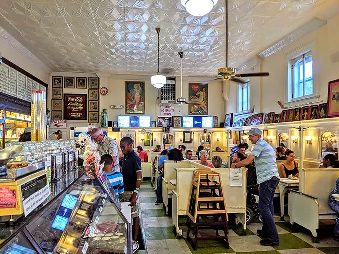 Where everybody knows your name... and your favorite milkshake! This bustling dining area is the heart of Crown Candy Kitchen's charm.