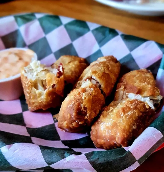 These aren't your average eggrolls—they're cultural ambassadors in crispy jackets, stuffed with corned beef and served with dipping delight.