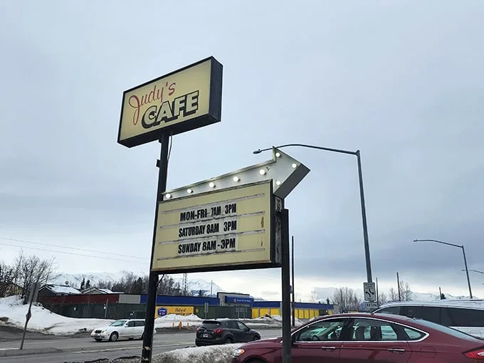Judy's sign: A beacon of hope for the hungry, standing tall against the Alaskan sky. It's like the North Star, but tastier.