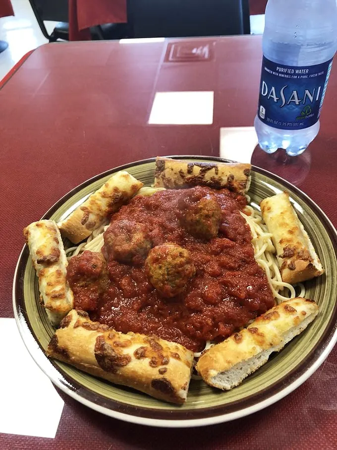 Mama mia! This plate's got more Italian flair than a Vespa scooter rally. Spaghetti, meatballs, and garlic bread – the holy trinity of comfort food.