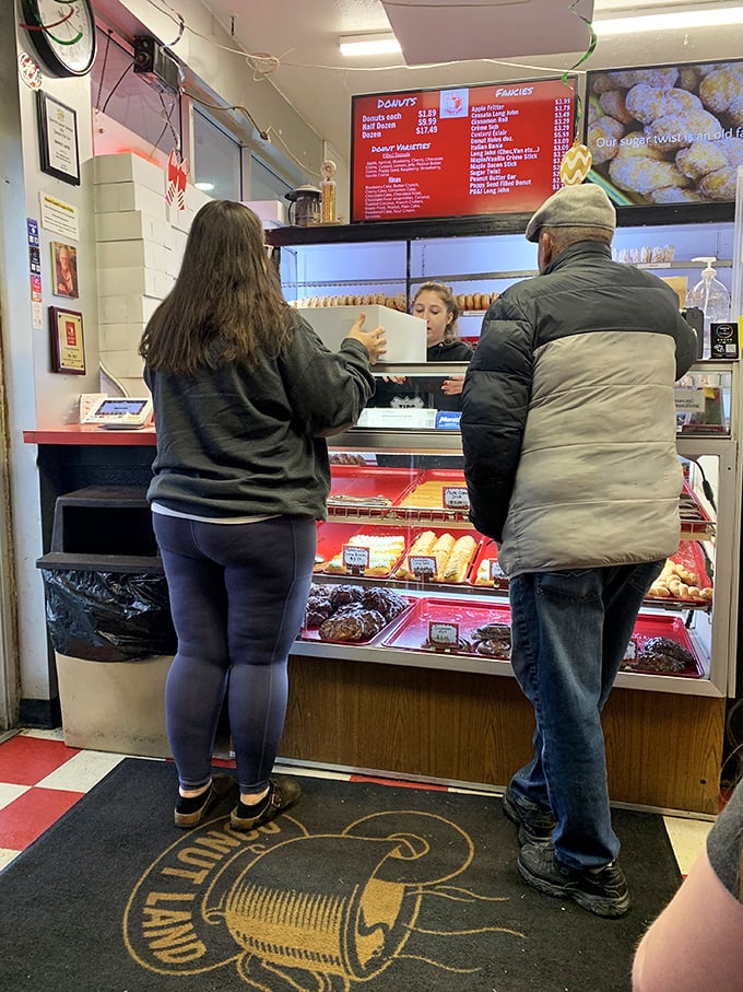 The universal language of donuts brings everyone together. That moment of anticipation while waiting your turn is part of the experience.