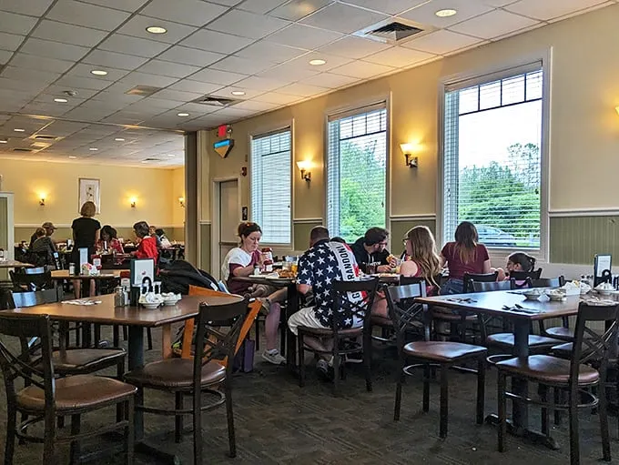 A slice of small-town America, served fresh daily. These happy diners aren't just eating – they're participating in a time-honored tradition of good food and even better company.