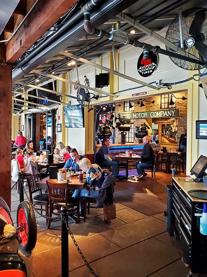 Real people enjoying real food in a space that celebrates American ingenuity. Notice nobody's looking at their phones—the food has their full attention.