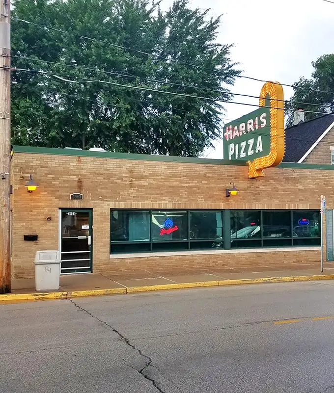 Harris Pizza: The OG of Quad Cities style. That retro sign isn't just illuminated – it's enlightened. Carry-out only? Challenge accepted!