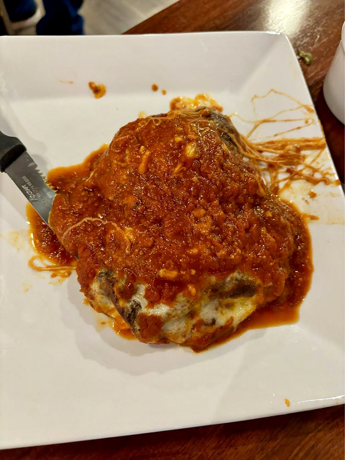 Chicken Parmesan that could make an Italian grandmother weep with joy! Golden, crispy, and smothered in sauce – bellissimo!