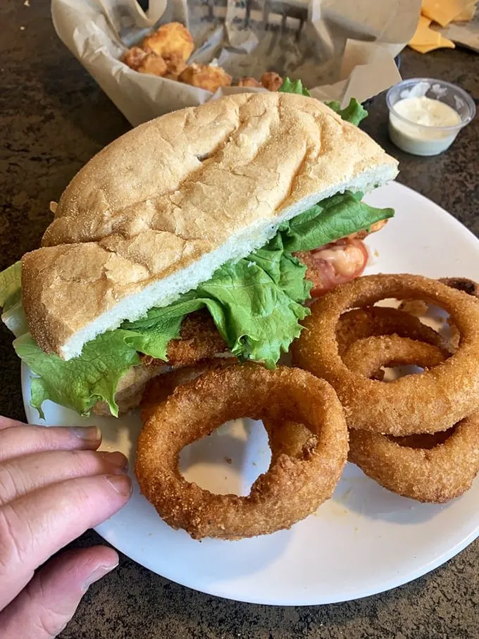 Half shrimp po' boy and onion rings: A taste of New Orleans meets Midwest comfort. It's like a culinary exchange program that benefits your taste buds.