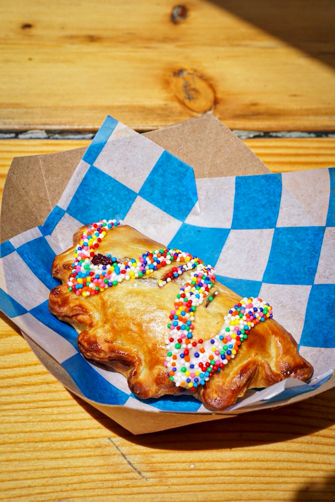 Handheld happiness! This sprinkle-topped treat is like a portable party, no RSVP required – just bring your appetite and dive in.
