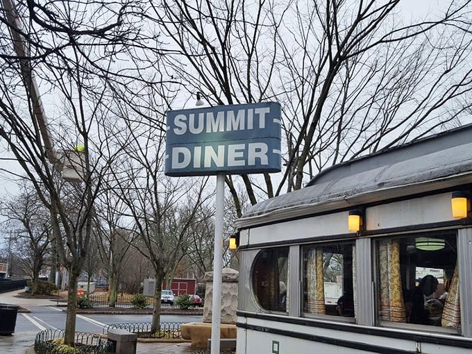 Even in winter, the Summit Diner sign promises warmth inside – both from the griddle and the conversation that's been flowing since 1929.