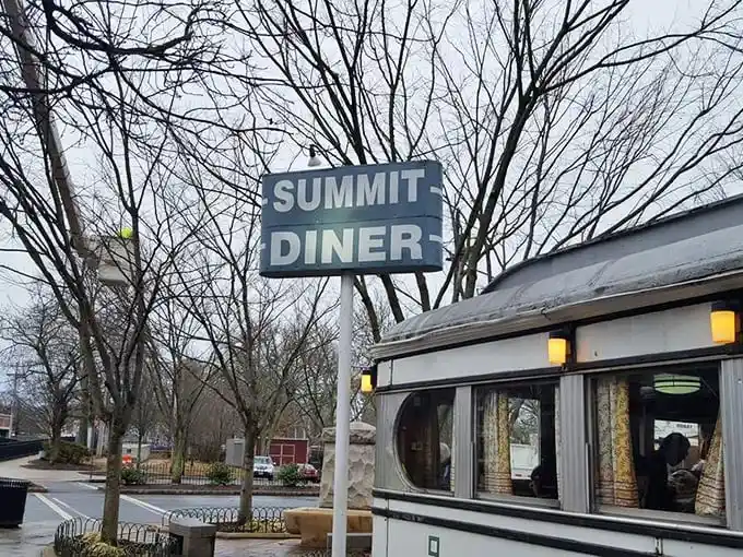 Even in winter, the Summit Diner sign promises warmth inside – both from the griddle and the conversation that's been flowing since 1929.