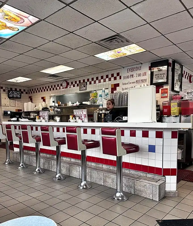 The counter experience—where solo diners find community, regulars establish territories, and the grill's sizzle provides the perfect soundtrack.