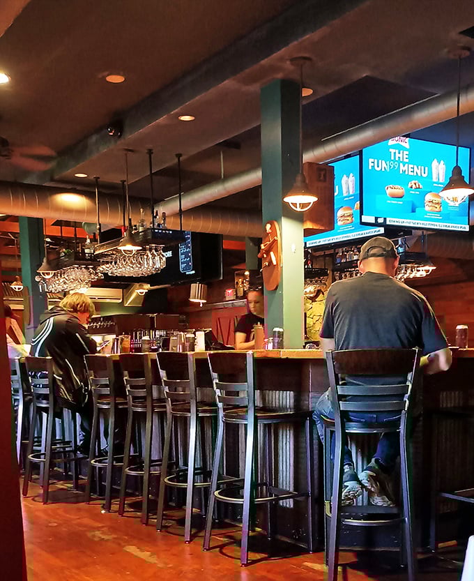 The bar at Tuckaway isn't just where drinks are served—it's command central for serious eating operations and spontaneous friendships.