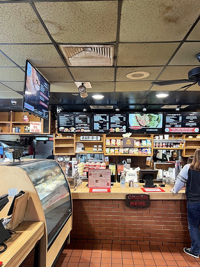 Order up! This counter is where BBQ dreams come true. Pro tip: Arrive hungry, leave happy (and possibly in need of elastic waistbands).
