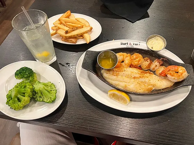 A plate that screams "treat yo' self!" This fillet and seafood combo is the culinary equivalent of winning the lottery.