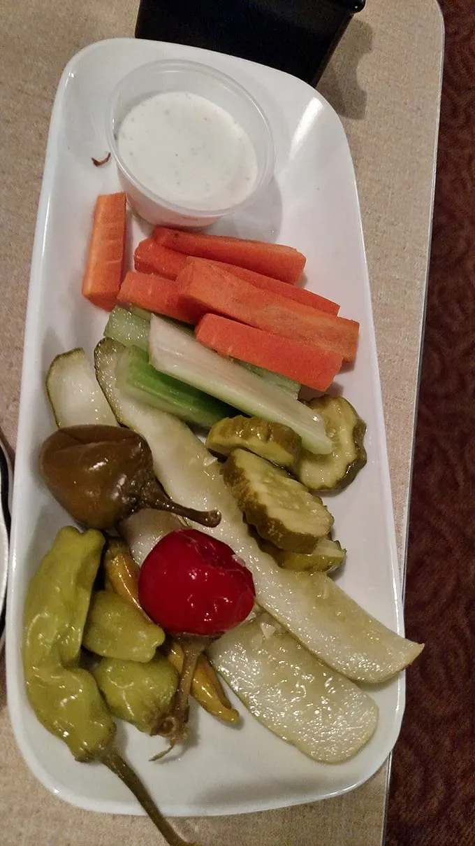 The relish tray: a rainbow of crunchy delights. It's like nature's candy store, but with more pickles and less guilt.