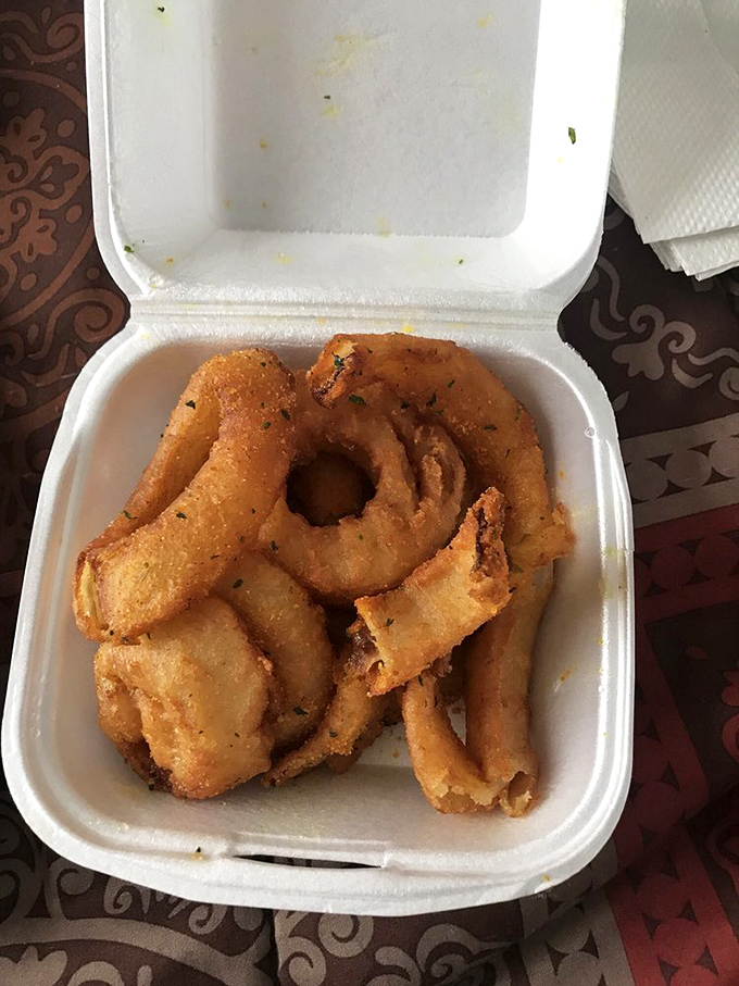 Crispy, golden onion rings that shatter with each bite—the unsung heroes of the Ching's side dish lineup.