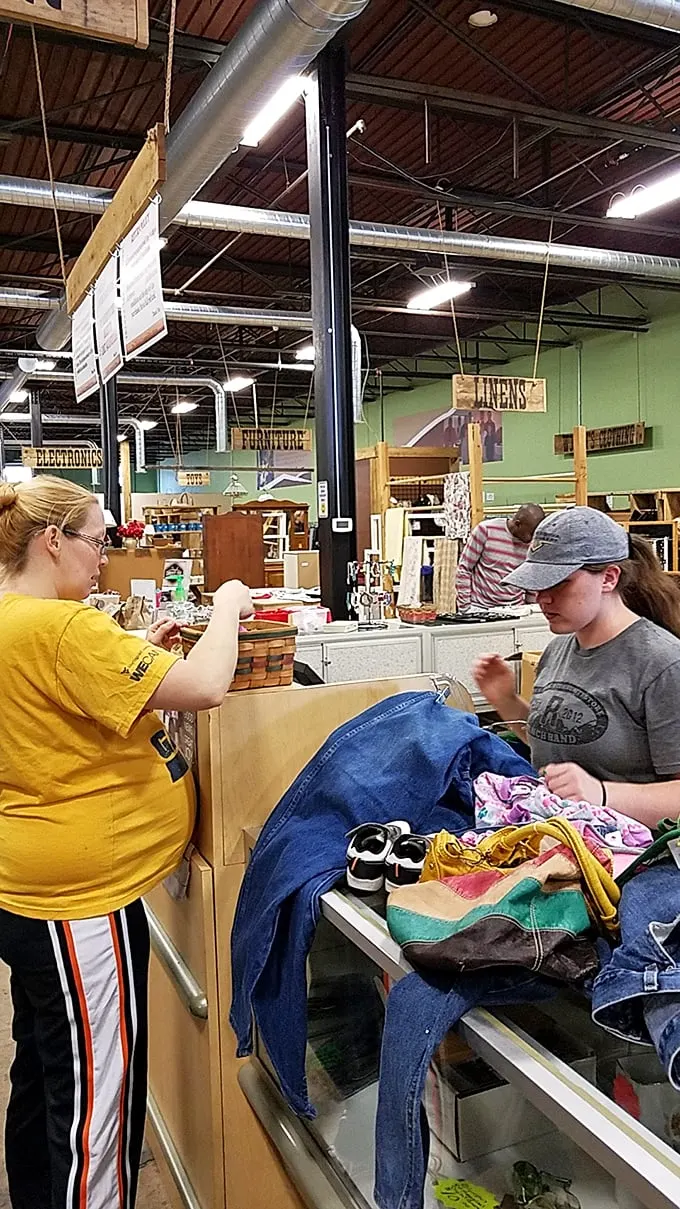 Thrift store gold rush in action! These savvy shoppers know the thrill of the hunt. May the odds be ever in your favor, bargain seekers!