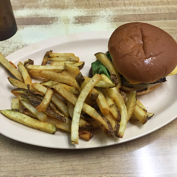 Burger bliss awaits! This all-American classic, paired with a mountain of golden fries, is comfort food at its finest. Diet? What diet?