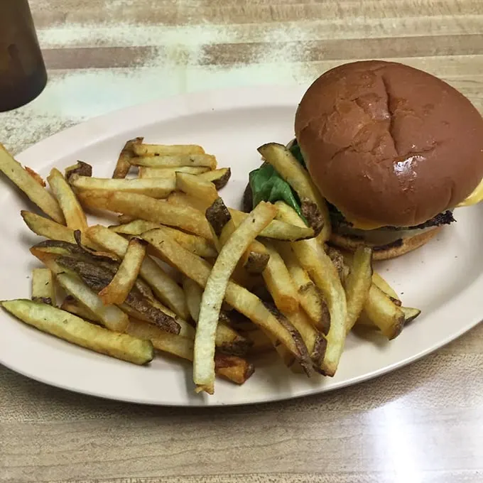 Burger bliss awaits! This all-American classic, paired with a mountain of golden fries, is comfort food at its finest. Diet? What diet?