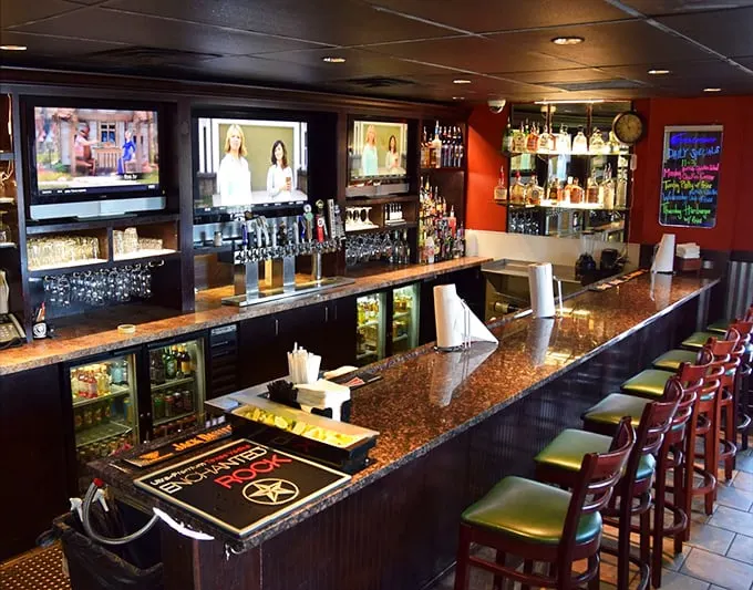 The bar area beckons with the promise of cold beer, multiple screens, and the kind of conversations that only happen during overtime.