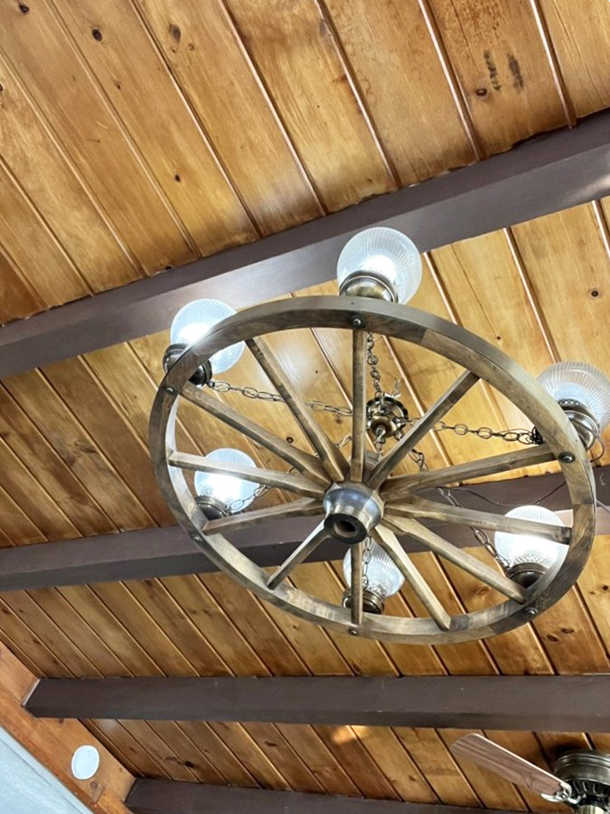 Look up and marvel! This wagon wheel chandelier is the crown jewel of rustic chic. It's like the Sistine Chapel of breakfast joints.