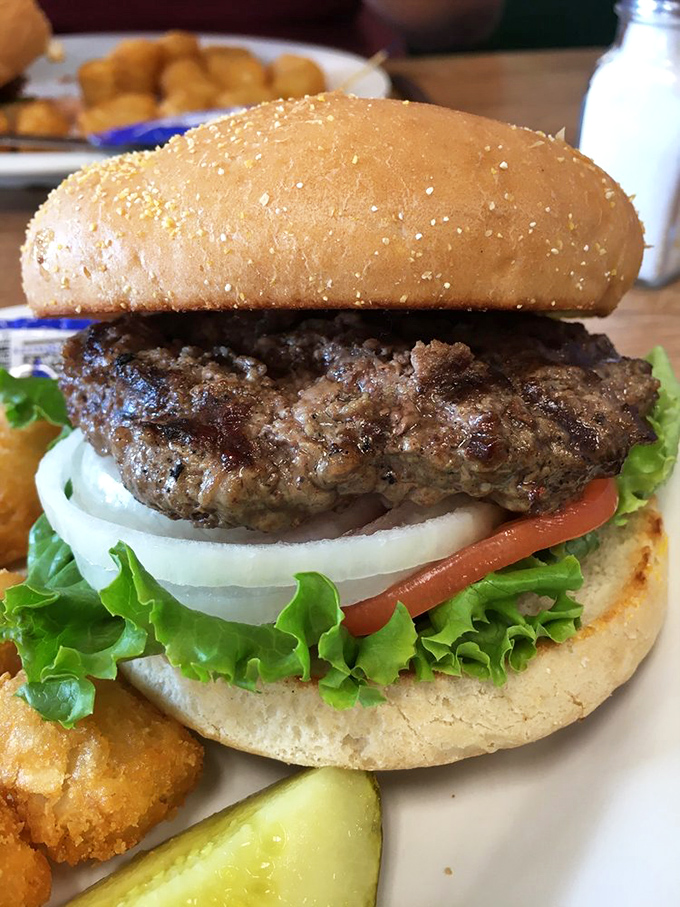 Behold the classic burger in all its glory! This isn't just a meal; it's a work of art that belongs in the Louvre of Lunch.