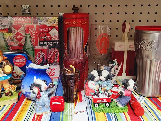 Coca-Cola collectibles that fizz with nostalgia. That straw dispenser would make my kitchen counter feel like a 1950s soda fountain.